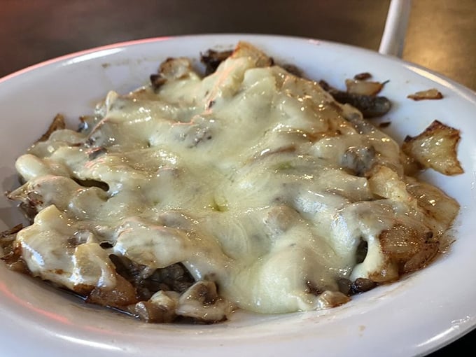 What looks like a simple side of mushrooms reveals itself as a bubbling, cheesy masterpiece that could convert even the most devoted carnivore.