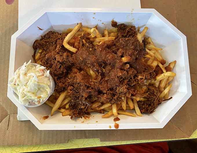 When pulled pork meets a mountain of crispy fries and creamy cole slaw, beautiful things happen on your plate.
