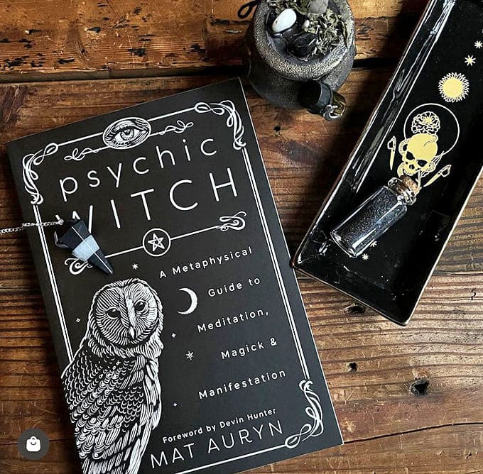 "Psychic Witch" rests beside ritual tools on weathered wood – a modern grimoire for those who prefer their magic with a side of psychology.