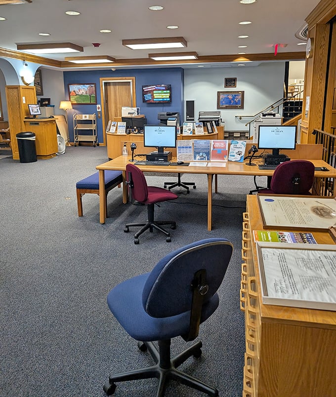 Modern technology meets historic architecture as computer stations provide digital resources beneath the library's classical ceiling.