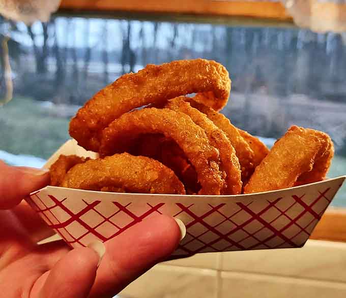 These onion rings achieve the impossible balance &ndash; crispy enough to satisfy that crunch craving, yet tender enough to bite through without wearing the whole ring.