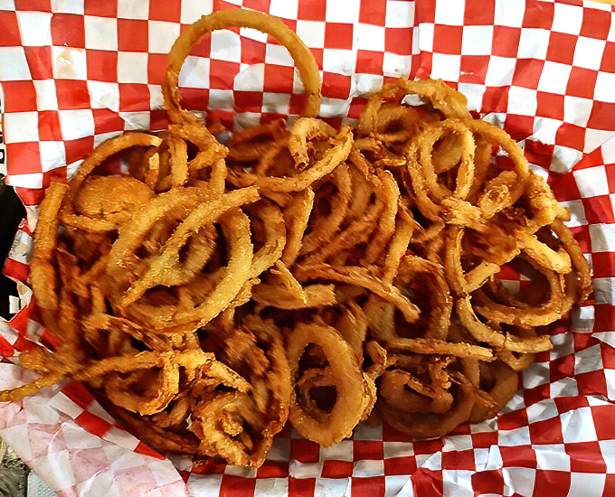 These aren't just onion rings; they're crispy, golden tanglers that'll have you swatting away the hands of tablemates trying to "just have one."