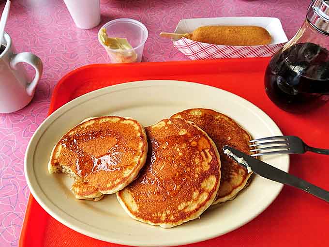 These golden pancakes aren't just breakfast, they're an experience – fluffy discs of perfection waiting for a cascade of maple syrup.