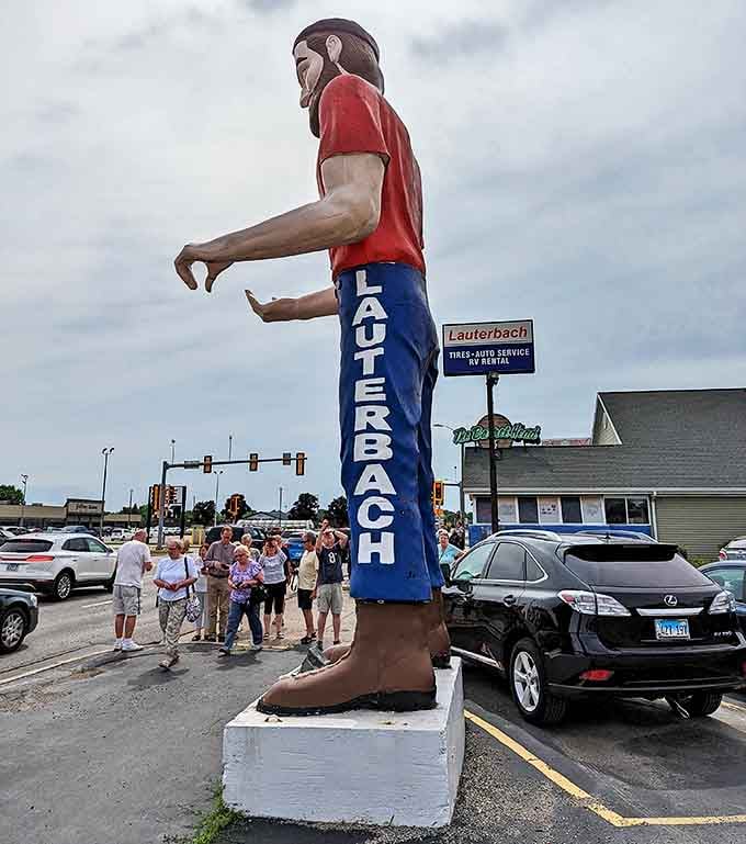 Cameras at the ready! Visitors can't resist documenting their encounter with this oversized slice of vintage highway culture.