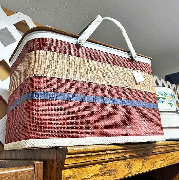 This classic picnic basket has probably seen more outdoor feasts than most Instagram influencers combined.