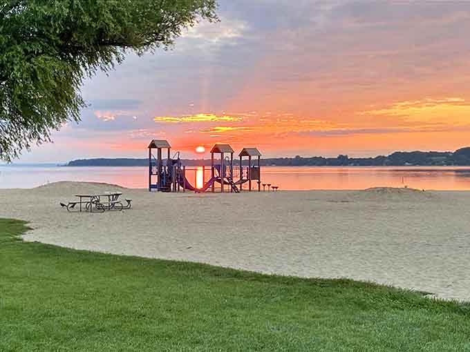Childhood joy in its purest form &ndash; the playground silhouetted against a sunset that even the kids pause to admire.