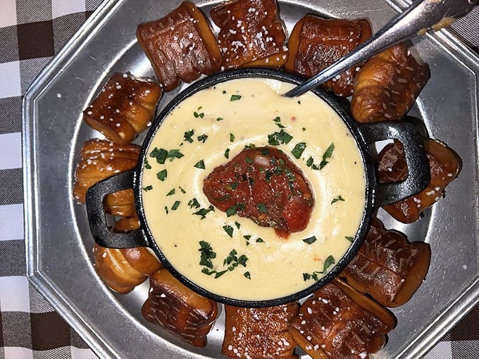 Fondue lovers rejoice! Warm cheese dip surrounded by pretzel bites creates a shareable moment of pure indulgence that brings tables together.