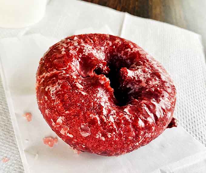 Red velvet donuts with cream cheese frosting &ndash; proof that breakfast can double as dessert without anyone batting an eye.