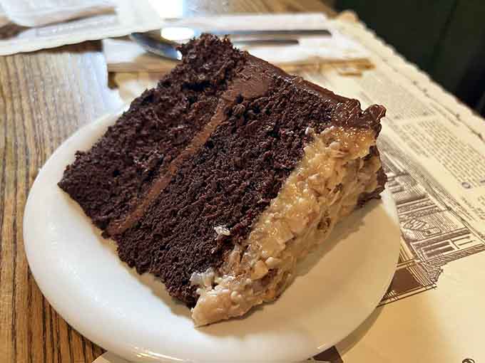 German Chocolate Cake towers with layers of coconut-pecan frosting, making dessert feel less like an option and more like a delicious obligation.