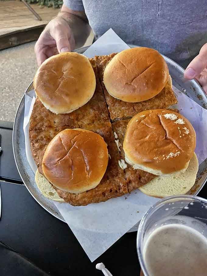 This massive breaded pork tenderloin could double as a Frisbee, stretching well beyond its bun in true Midwest fashion.