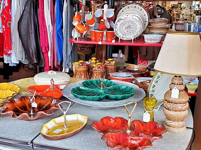 Colorful vintage serving pieces that once graced holiday tables now wait for new celebrations &ndash; each chip and pattern tells a story.