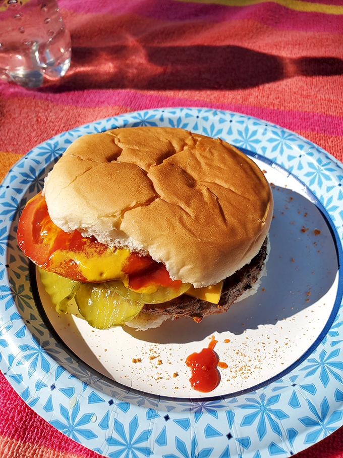 A classic Moonburger with pickles and cheese - proof that sometimes the simplest combinations create the most profound flavors.