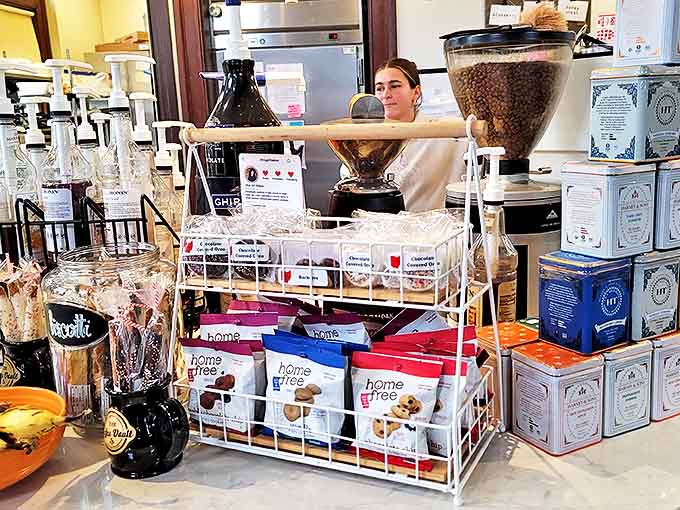 The counter display tempts you with treats and merchandise, turning a simple coffee run into a full shopping experience.