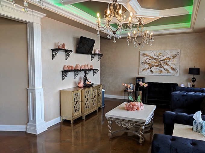 Sophisticated comfort reigns in this lounge where pink Himalayan salt lamps cast a warm glow and every design element whispers "relax, you've arrived."