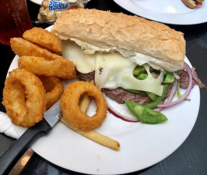This isn't just lunch; it's a masterpiece of beef and bread with golden rings that shatter like delicious glass.