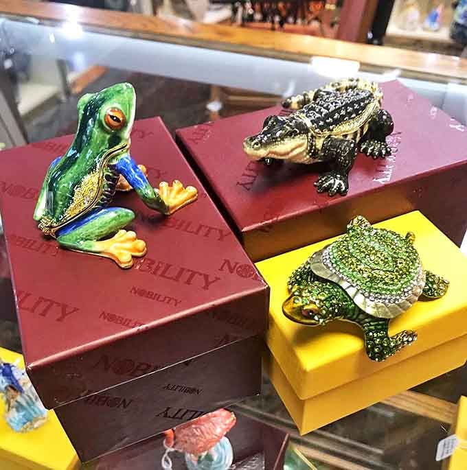 Swarovski creatures perched on their boxes like tiny jeweled pets, because sometimes whimsy comes in surprisingly elegant packages.