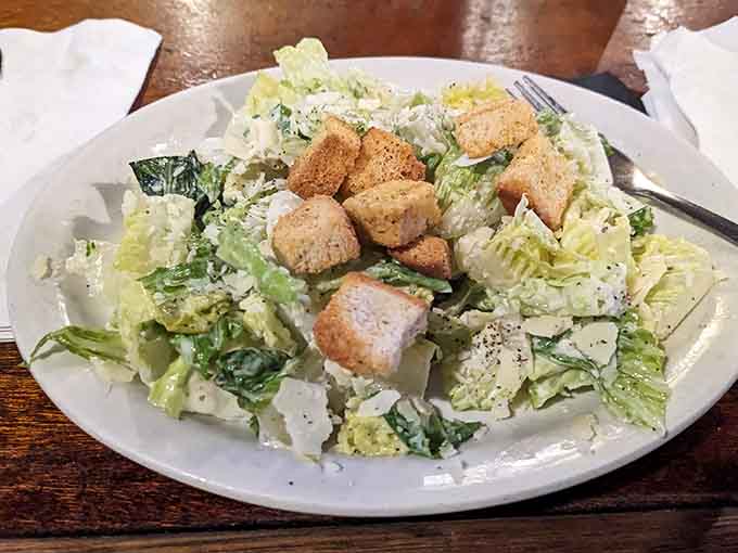 Fresh, crisp Caesar salad with generous croutons offers a lighter option that doesn't skimp on flavor or satisfaction.