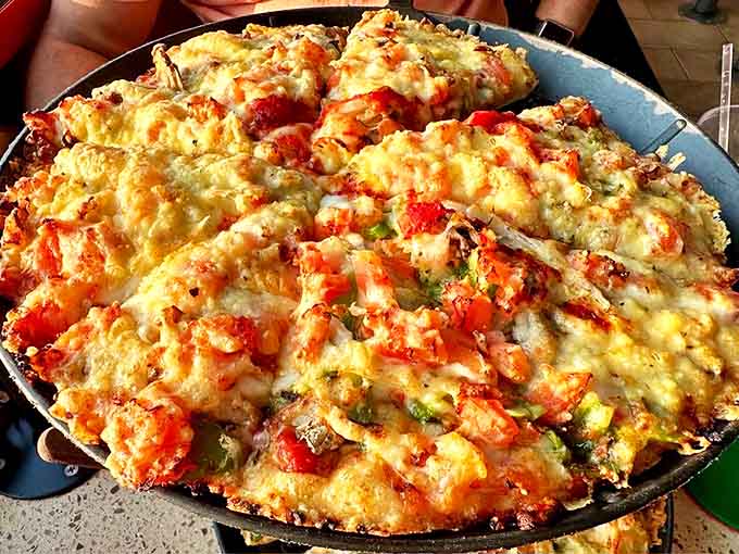 The Veggie Pizza proves plant-based toppings can create flavor symphonies that even dedicated carnivores secretly crave when nobody's watching.