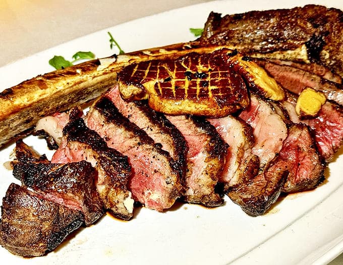The Tomahawk steak makes such a dramatic entrance that nearby tables applaud. It's not just dinner &ndash; it's performance art with marbling.