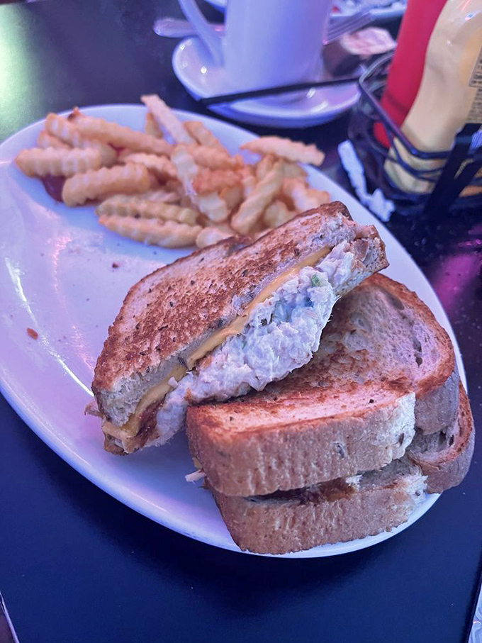 The humble tuna melt elevated to art form &ndash; perfectly grilled bread, melty cheese, and tuna salad that makes you wonder why you'd ever order anything else.