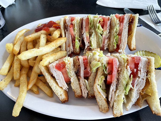 Turkey Club: The skyscraper of sandwiches&mdash;three stories of toasted perfection that makes lunch feel like an achievement.