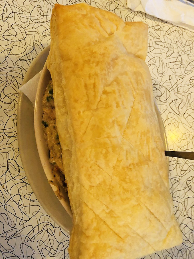 Beneath this golden pastry dome lies a turkey pot pie so comforting it's like Thanksgiving and a warm hug had a delicious baby.