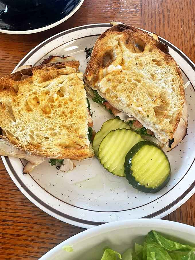 This sandwich isn't just lunch &ndash; it's salvation between two slices of perfectly toasted bread, accompanied by house-made pickles.