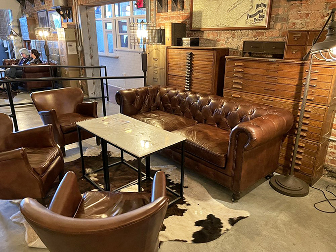 Vintage leather meets industrial chic in this cozy corner, where comfortable seating invites visitors to linger over their culinary discoveries.
