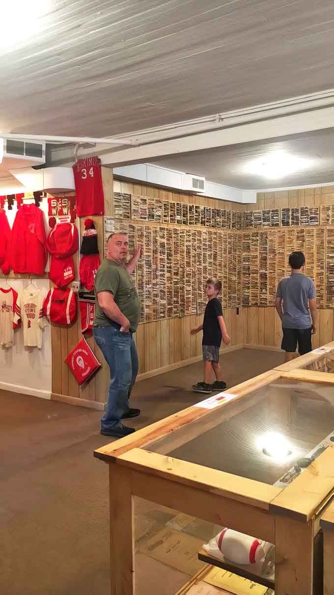 Visitors pose at the entrance, collecting photographic evidence of their close encounter with America's quirkiest architectural oddity.