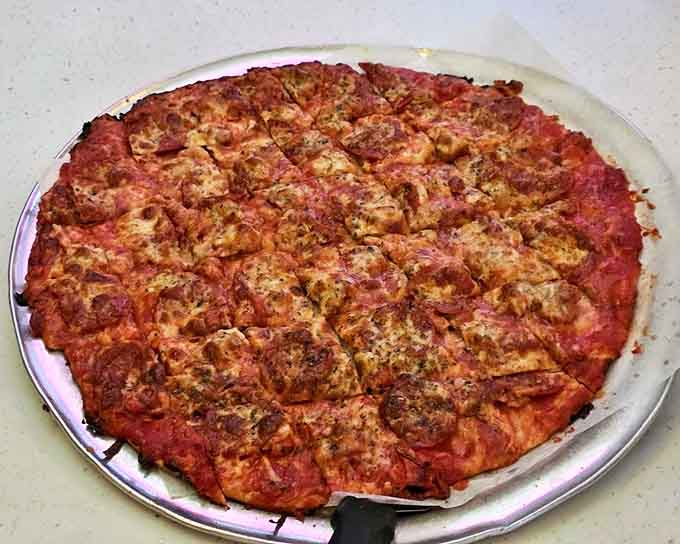 Every slice tells a story of tradition &ndash; the perfectly browned cheese and crispy edge on this sausage and pepperoni pizza is edible history.