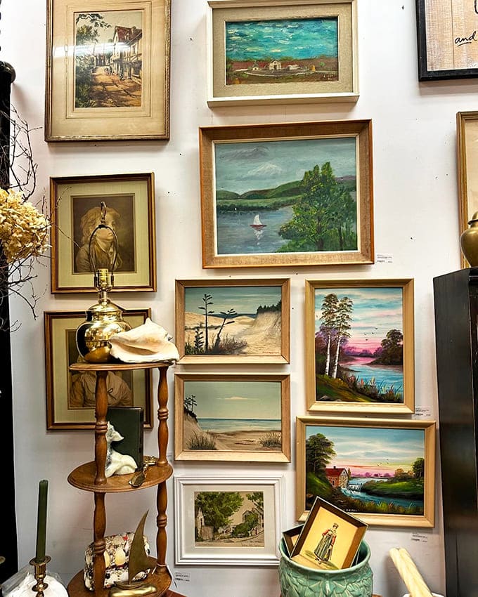 A gallery wall of vintage paintings and prints demonstrates how art from different eras can create a cohesive, stunning display.