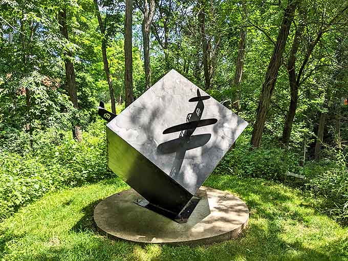 This geometric plane sculpture balances on its corner like it's defying physics, which honestly, it probably is doing somehow.