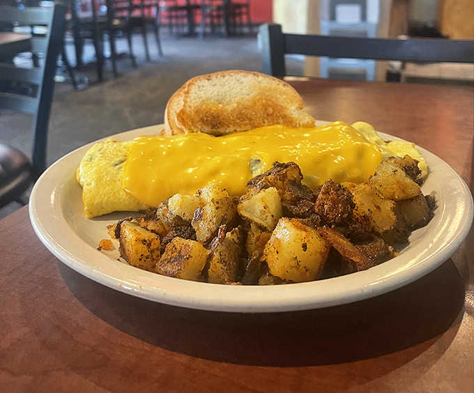 The Western Omelette arrives fluffy and generous, accompanied by those addictive Cajun home fries that have customers plotting return visits.