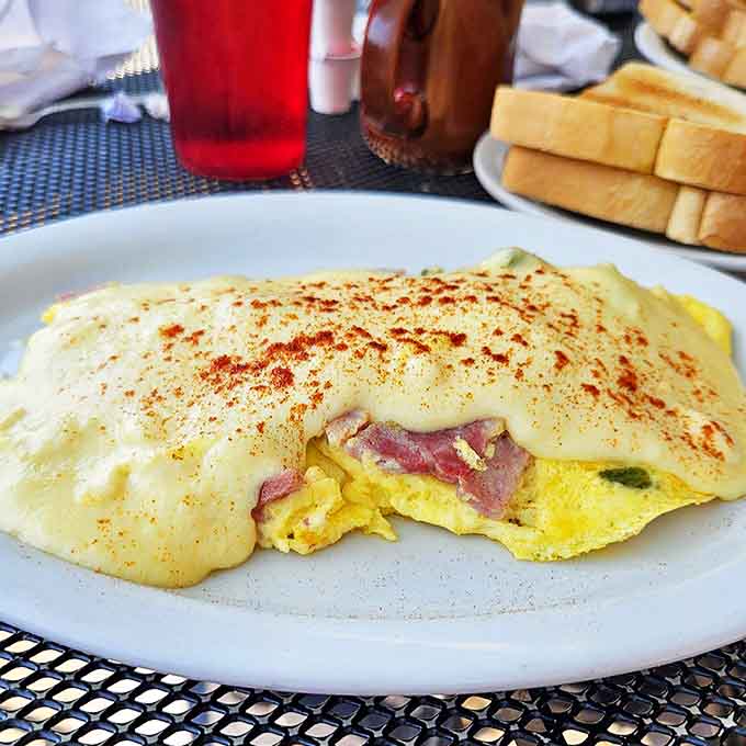 This Western omelette doesn't just have ham and peppers &ndash; it has enough fillings to qualify as a small apartment for cheese.