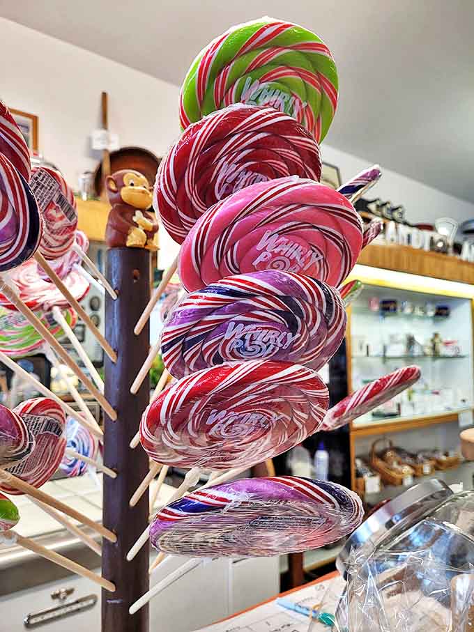 These hypnotic whirly pops stand like a colorful forest of sugar trees, each one promising hours of tongue-dyeing enjoyment and childhood flashbacks.