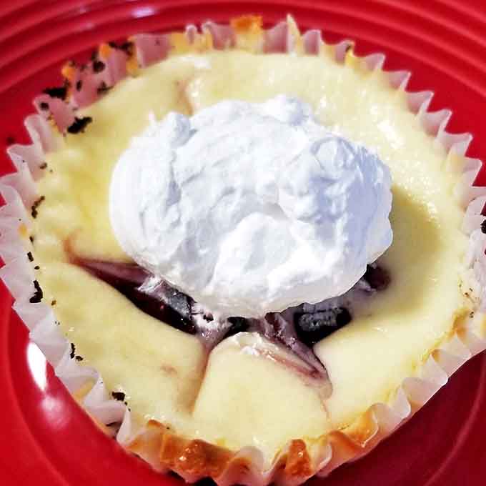 White chocolate raspberry cheesecake marbles ruby swirls through creamy ivory, creating a dessert that's as beautiful as it is delicious.