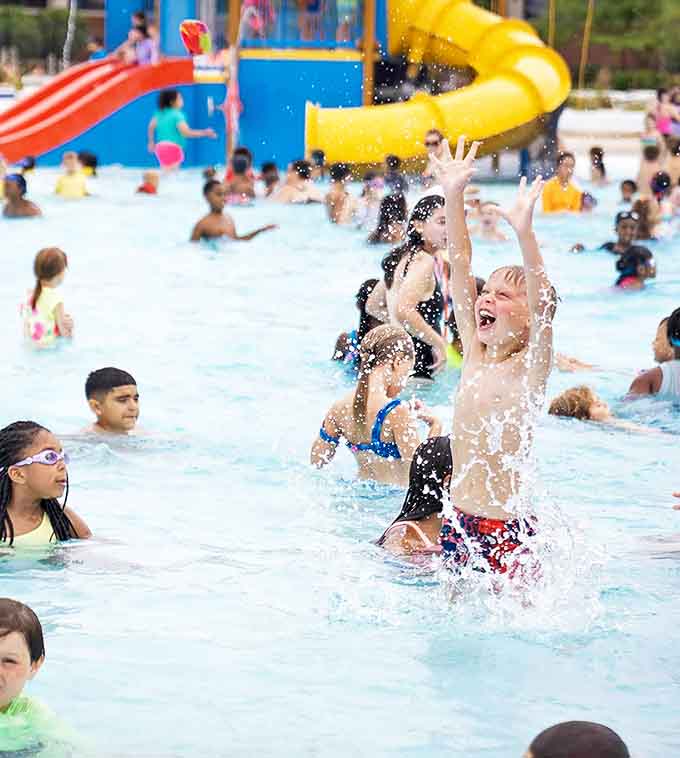 Pure joy captured in chlorinated water, proof that happiness is just a splash away when you're a kid.