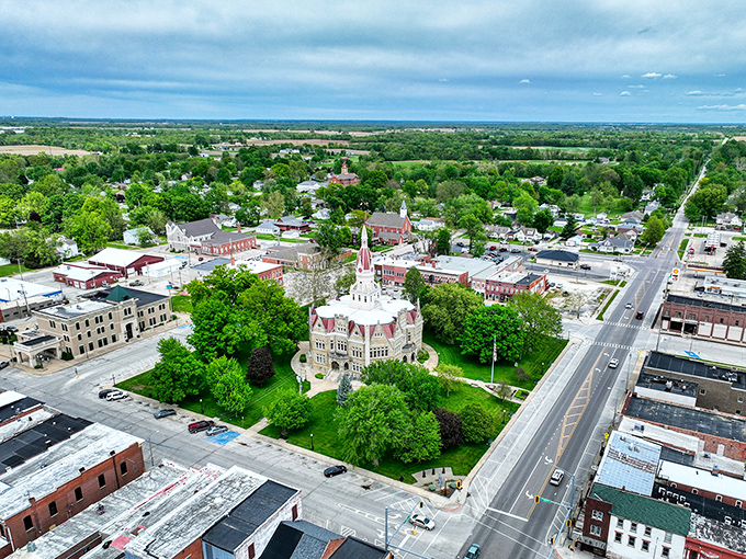 Wide Aerial View: Pittsfield nestles into the Illinois landscape like it grew organically from the soil, a perfect patchwork of historic buildings, green spaces, and Midwestern charm.