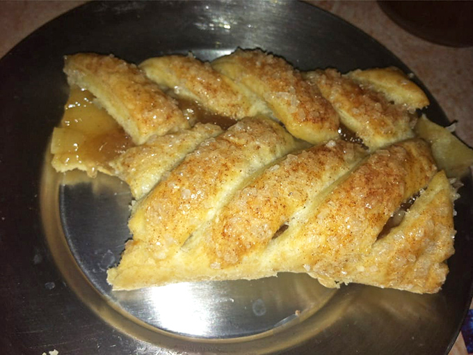 Flaky, golden apple pie with a generous sprinkle of cinnamon sugar – dessert that makes you grateful medieval bakers knew their craft.