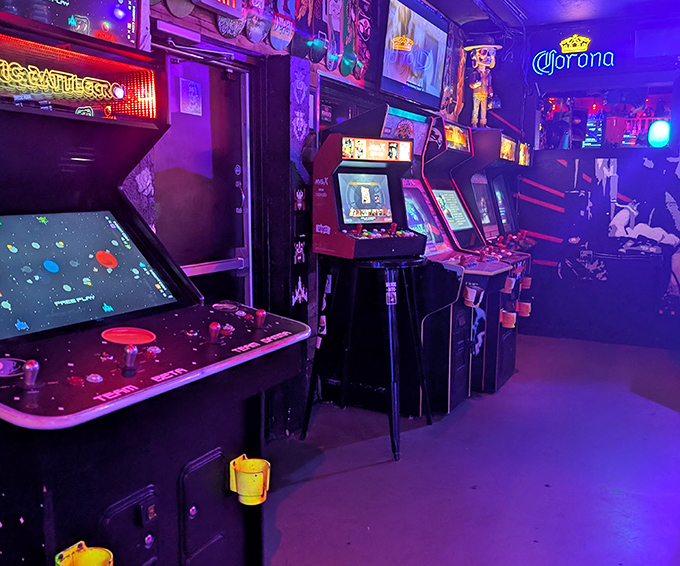 Classic arcade cabinets line the walls, their screens glowing with digital promises of glory &ndash; just like the good old days, minus the sticky floors.