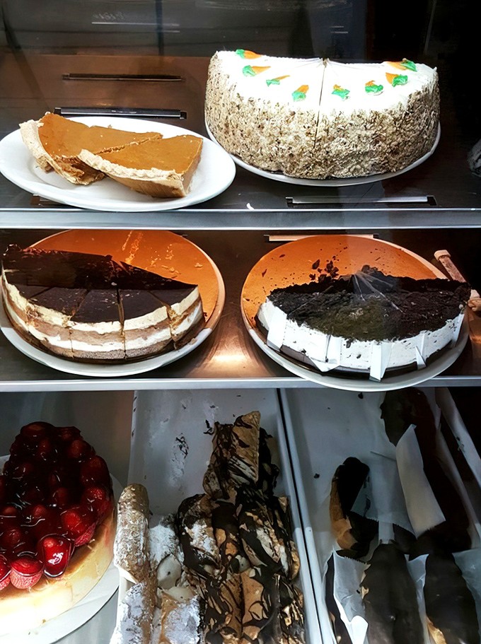 The dessert case: where diet plans go to die happy deaths. Each cake is like a different chapter in a delicious autobiography.