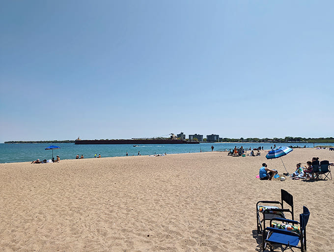 Summer brings families and sun-seekers who spread across the sand like they're claiming their own personal paradise, which honestly isn't far from the truth.