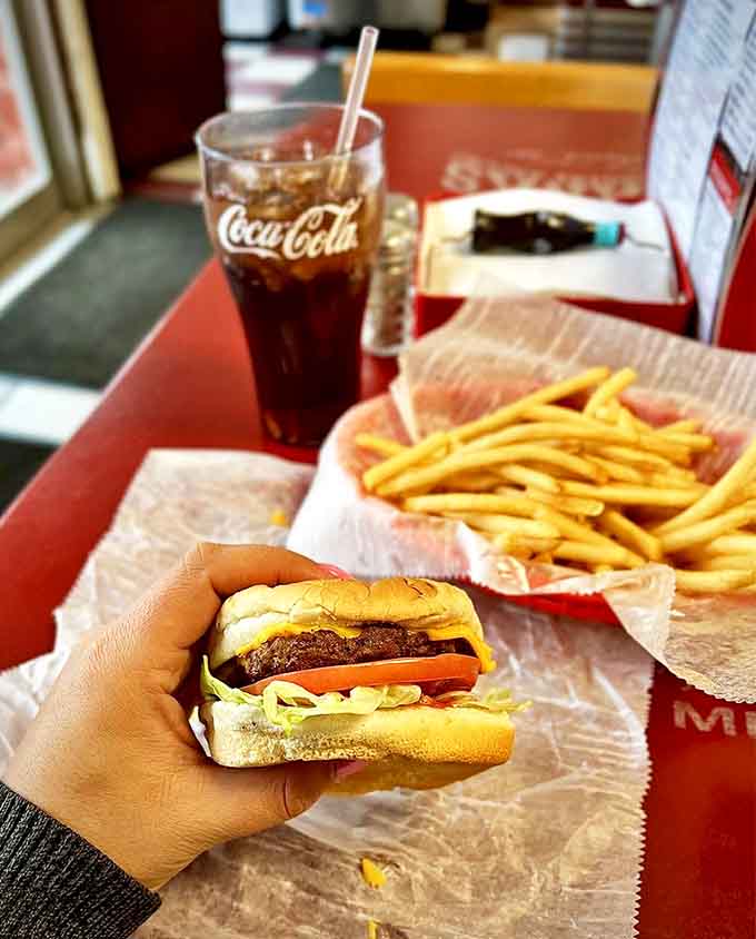 Burger: Behold the perfect hand-held masterpiece – juicy, perfectly proportioned, and demanding to be photographed before the first bite.