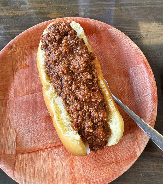 The chili dog in its natural habitat &ndash; no fancy plating required when the flavor does all the talking.