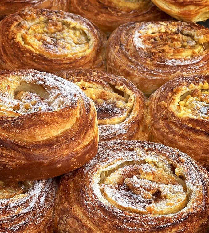 Those cinnamon roll swirls create hypnotic patterns that could make you forget your own name, especially when they're still warm from the oven.