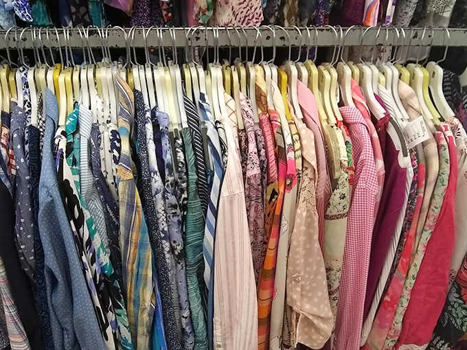 The clothing racks form a rainbow of possibilities &ndash; each hanger potentially holding that perfect piece you didn't know you needed.