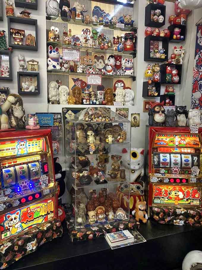 Vintage treasures and modern interpretations share shelf space in this carefully curated collection spanning decades of lucky cat history.