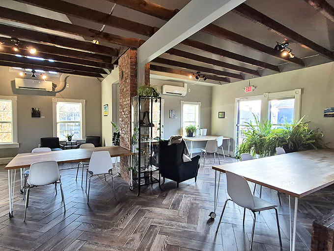 The airy, open dining area with its herringbone floors and exposed beams creates a space that's simultaneously sophisticated and comfortably casual.