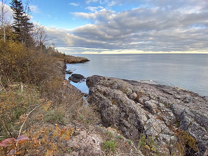Standing at the cliff's edge feels like being on top of the world, with Lake Superior stretching to the horizon like nature's infinity pool.