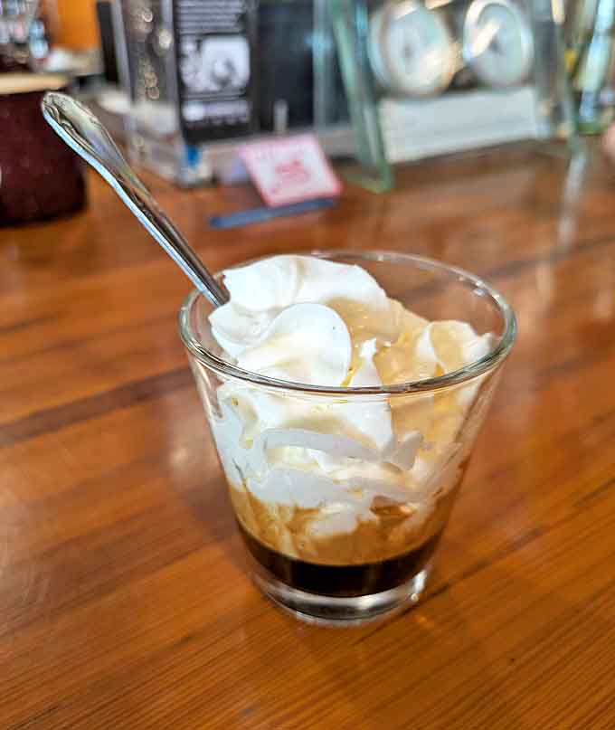 Espresso topped with whipped cream proves that sometimes the simplest combinations create the most elegant results, like coffee wearing a fancy hat.